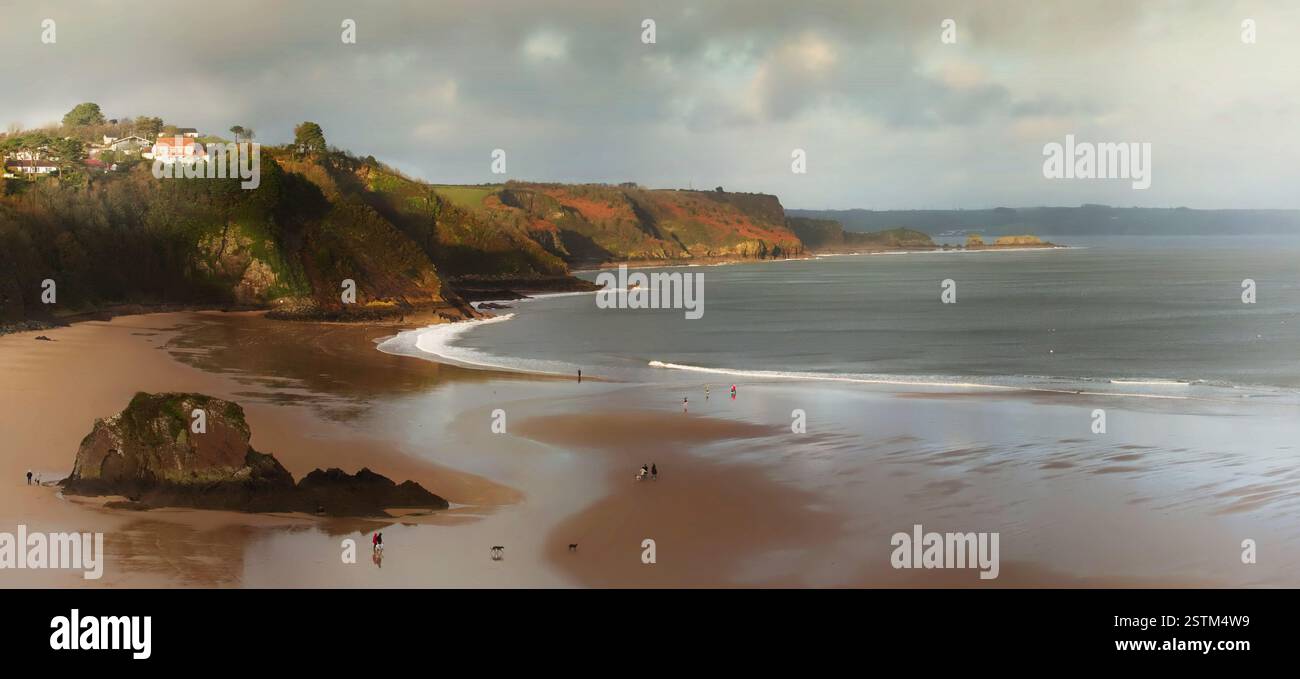Tenby North Beach, winter light after storm. Sweeping sands, cliffs ...