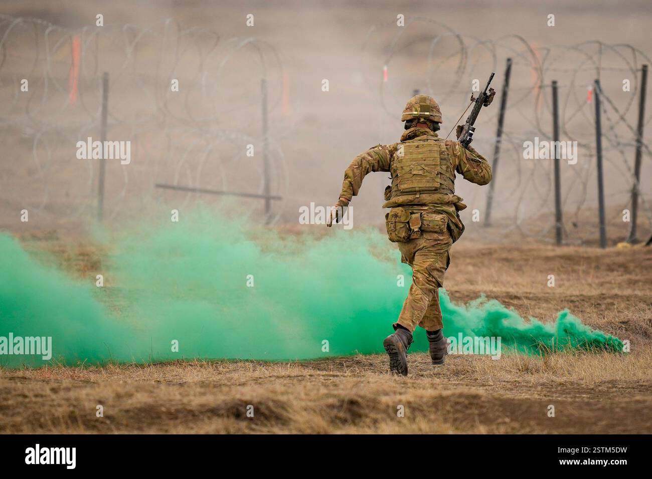 A serviceman runs during the Steadfast Dart 2025 exercise, involving ...