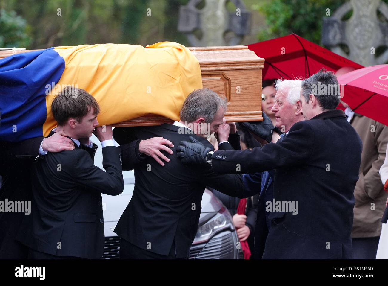 The coffin of Michael O'Sullivan is carried into the St John the ...