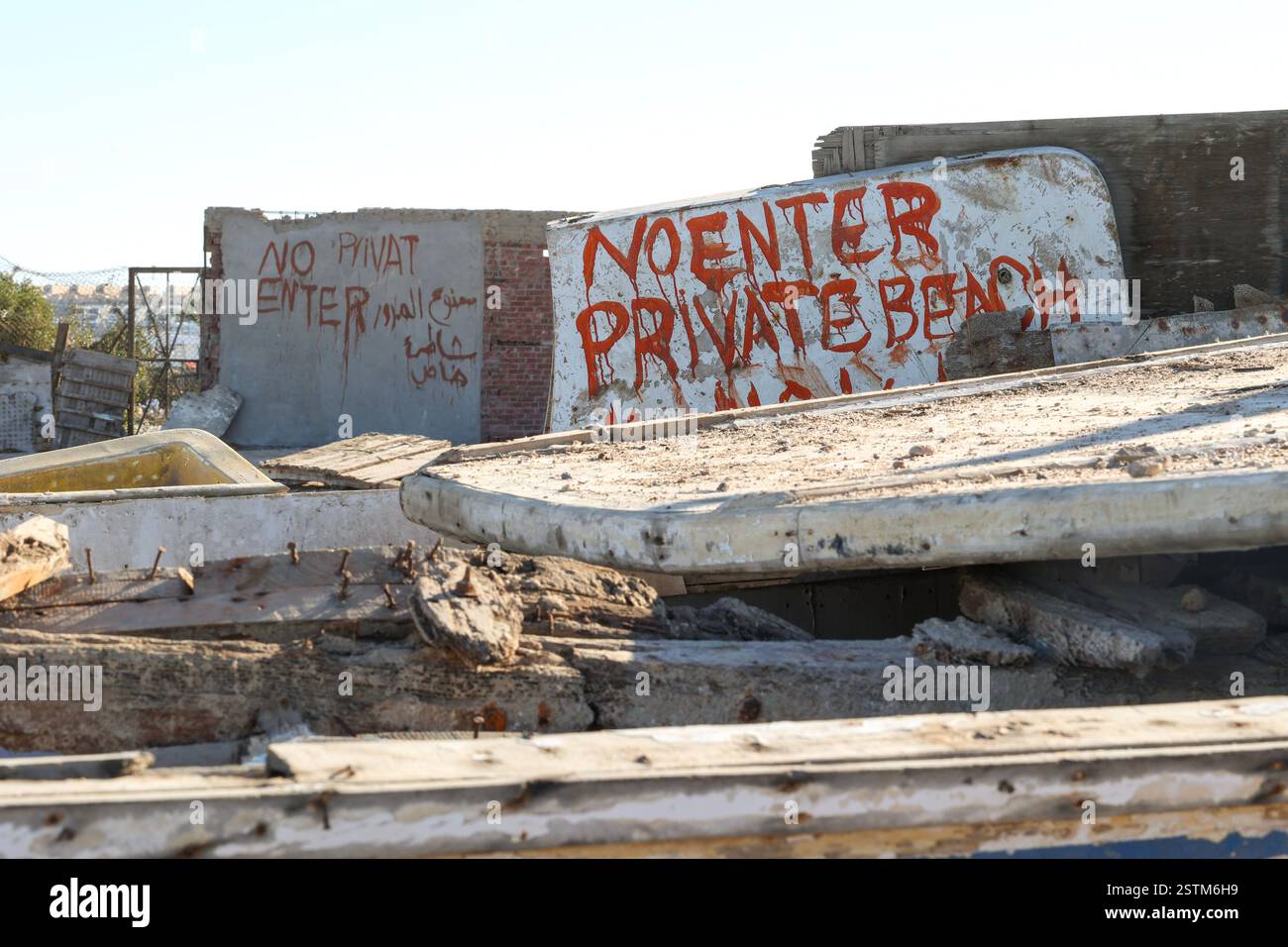 Graffiti sign on a concrete fence indicating No Entry on the beach in ...