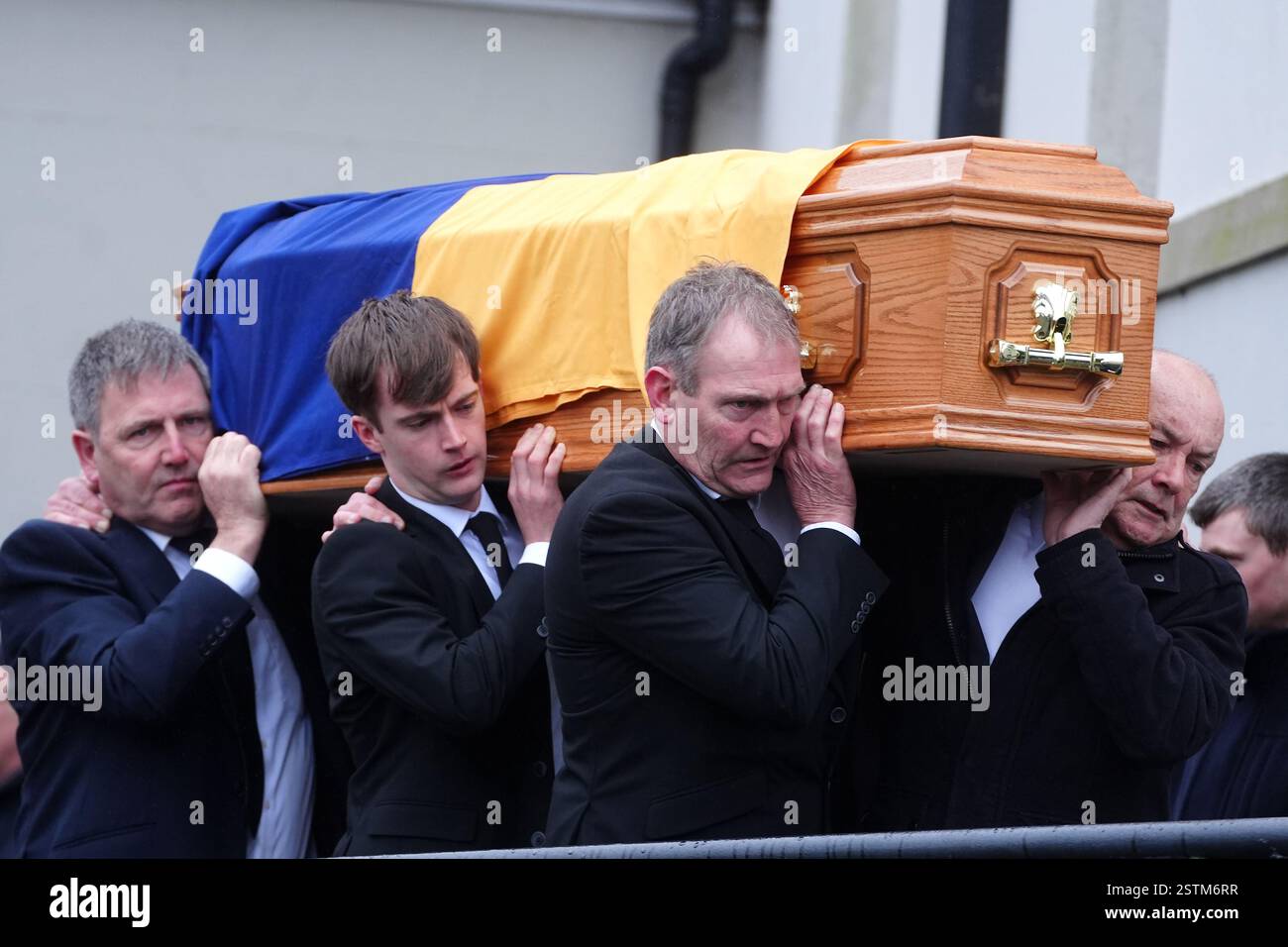 The coffin of Michael O'Sullivan is carried into St John the Baptist ...