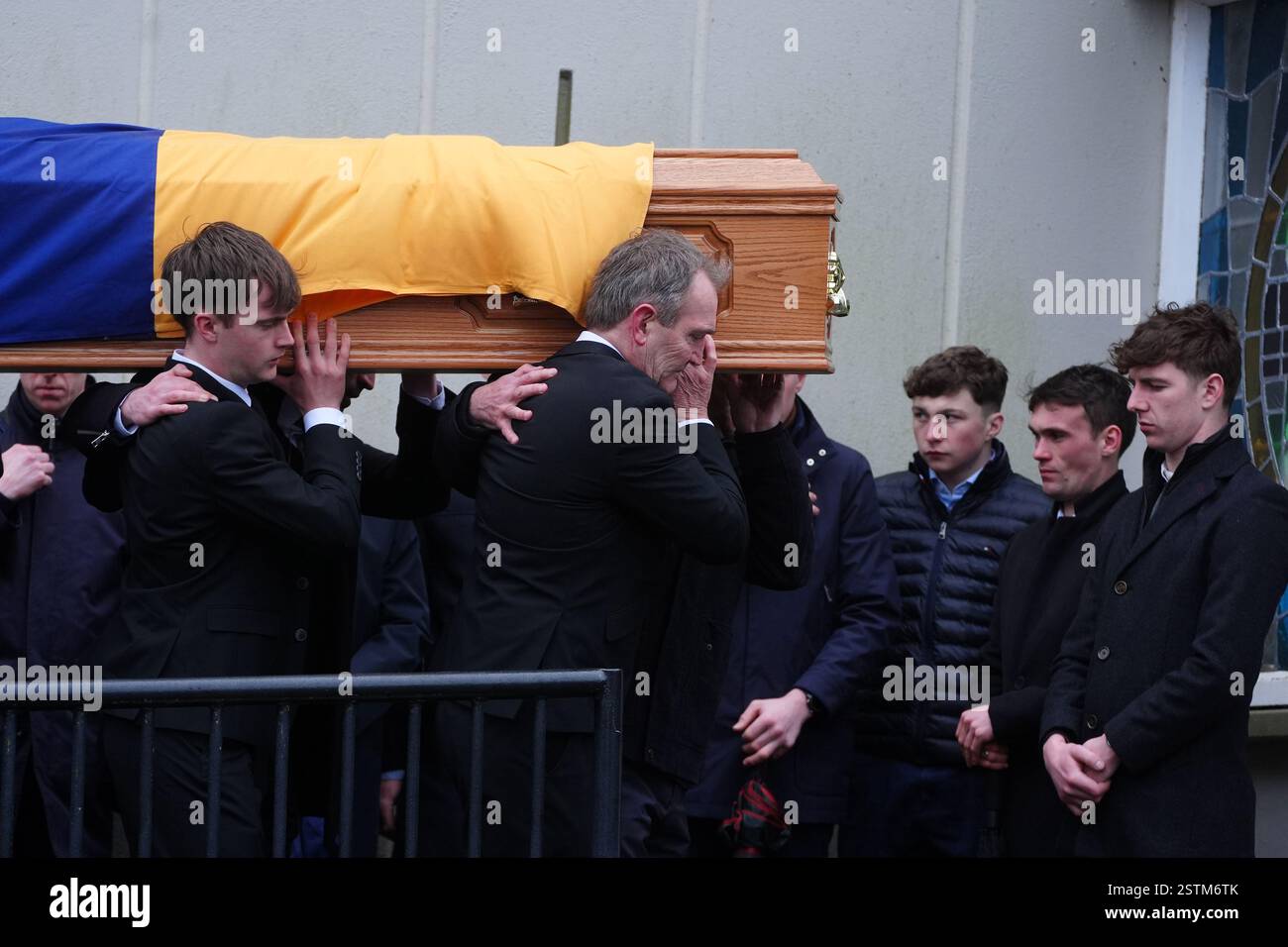 The coffin of Michael O'Sullivan is carried into St John the Baptist ...