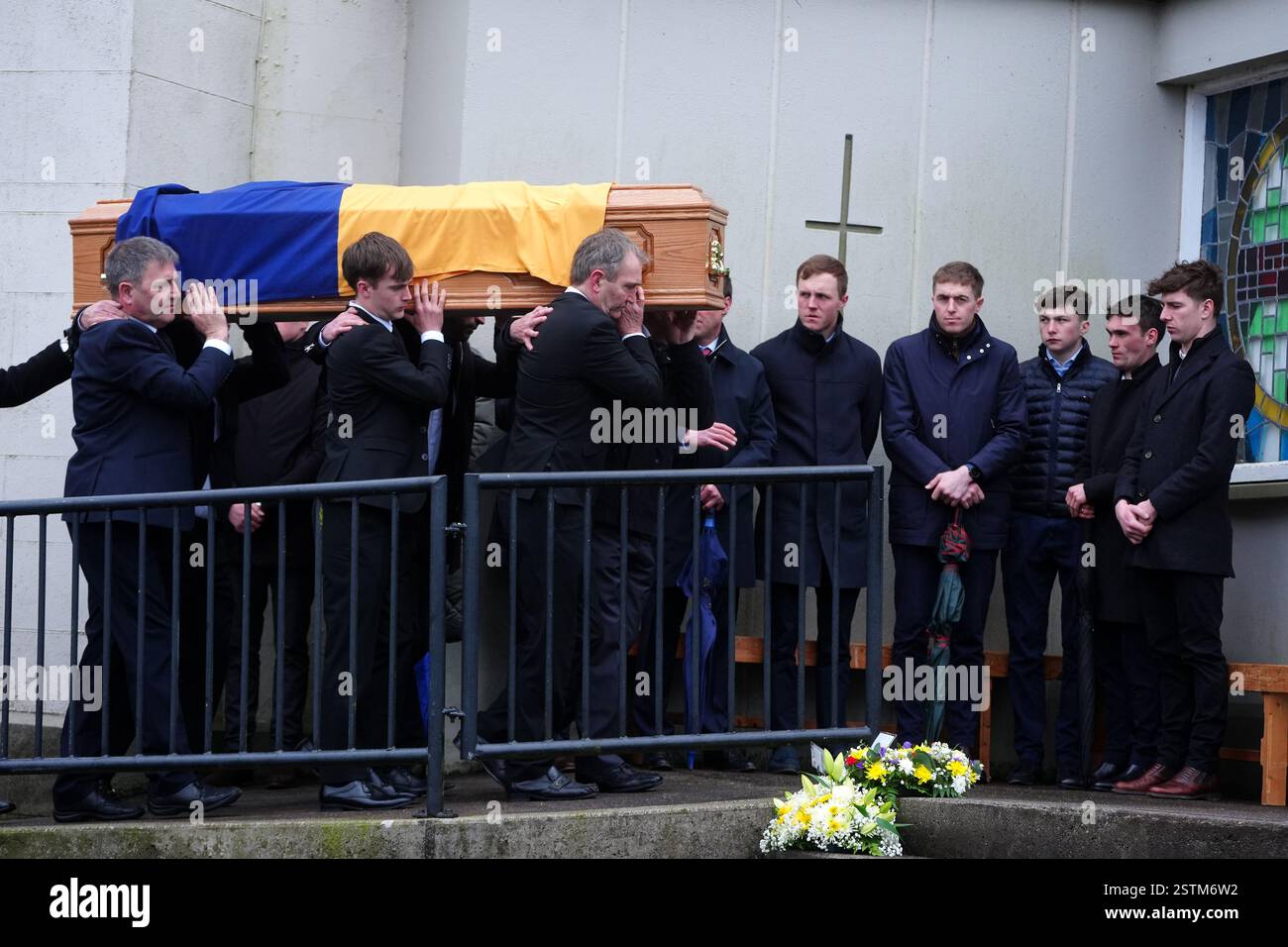 The coffin of Michael O'Sullivan is carried into St John the Baptist ...