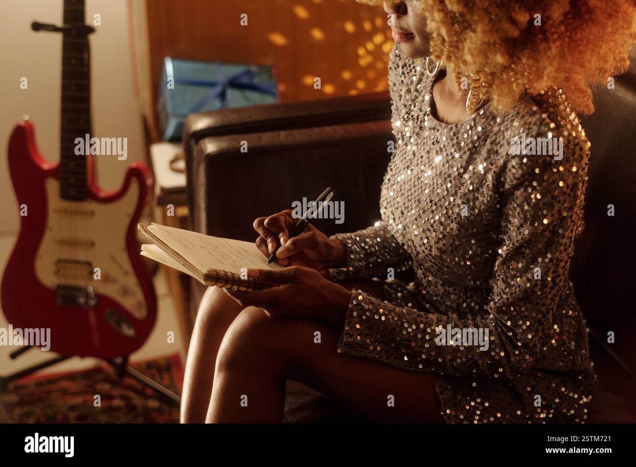Woman writing notes in living hi-res stock photography and images - Alamy