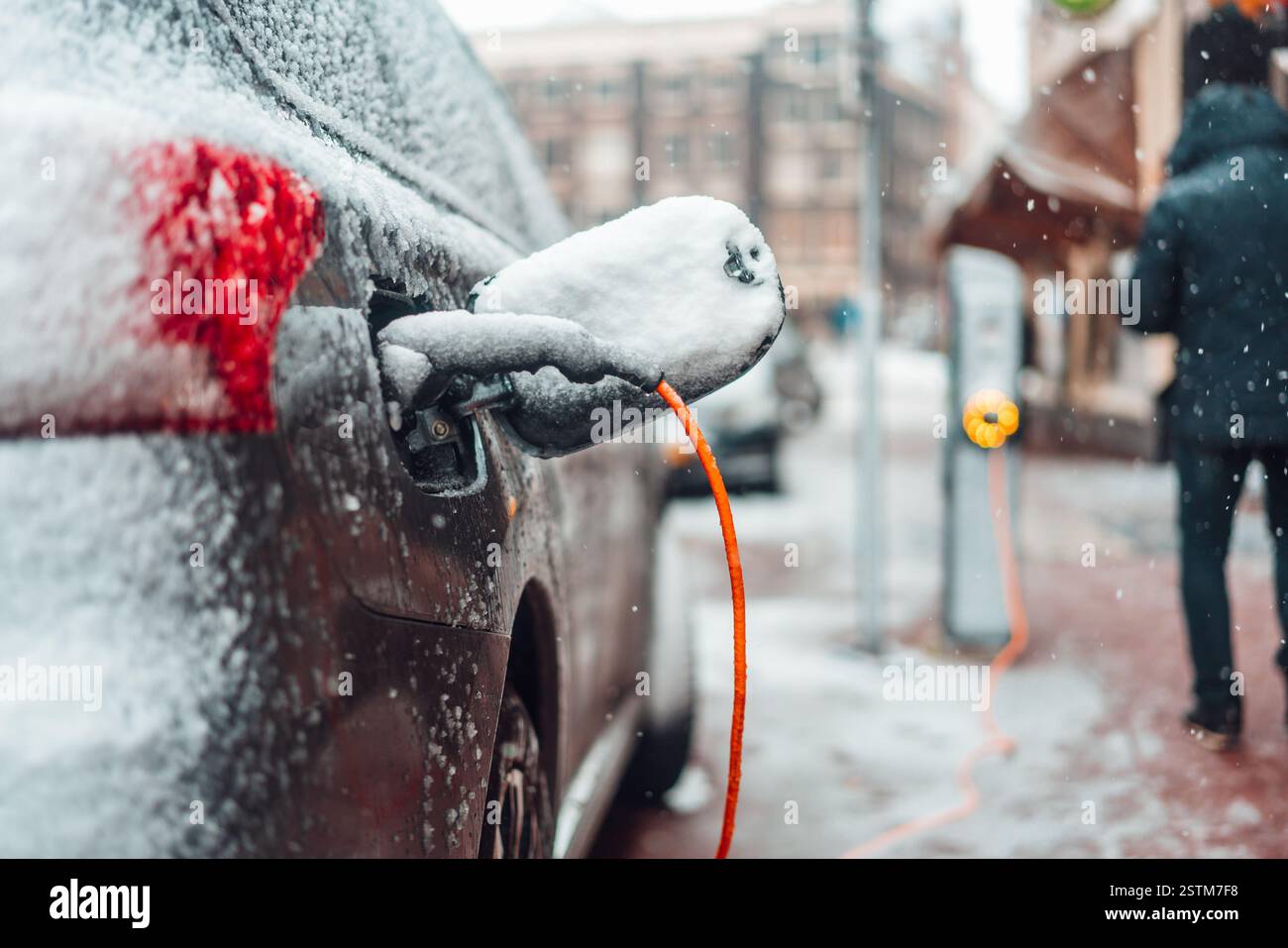 Electric car plug charging in the winter. Amsterdam, Netherlands Stock ...