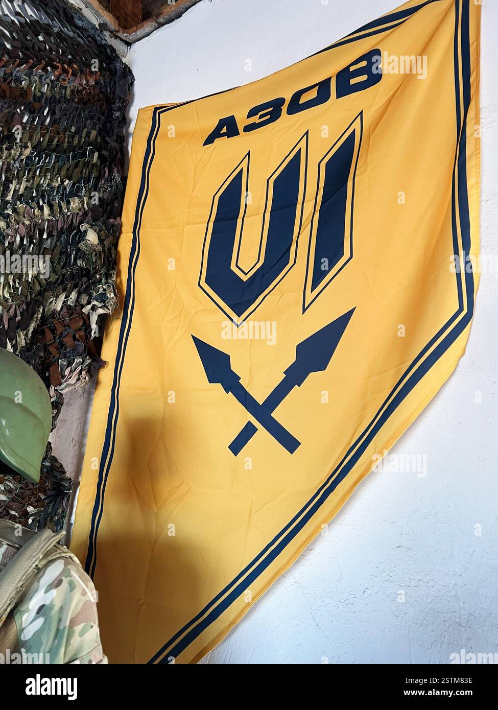 Velykyi Khodachkiv, Ukraine - February 18, 2025: A yellow Azov flag ...