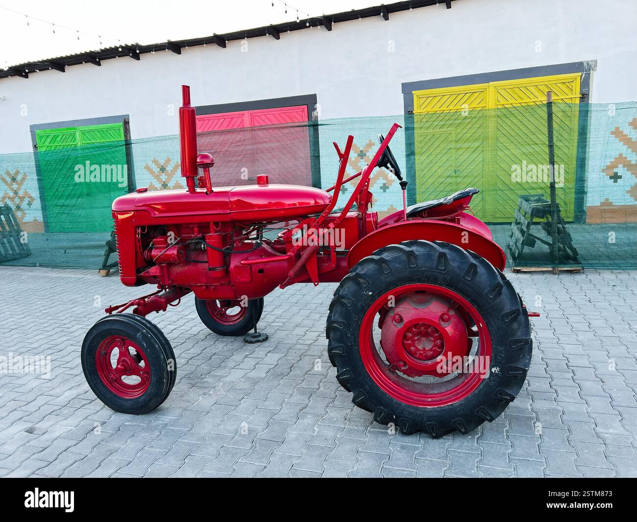 Velykyi Khodachkiv, Ukraine - February 18, 2025: An antique red tractor ...