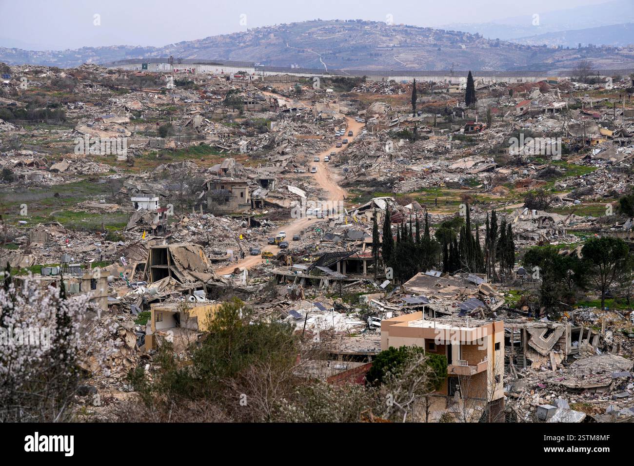 Lebanese citizens check the destruction in their village caused by the ...