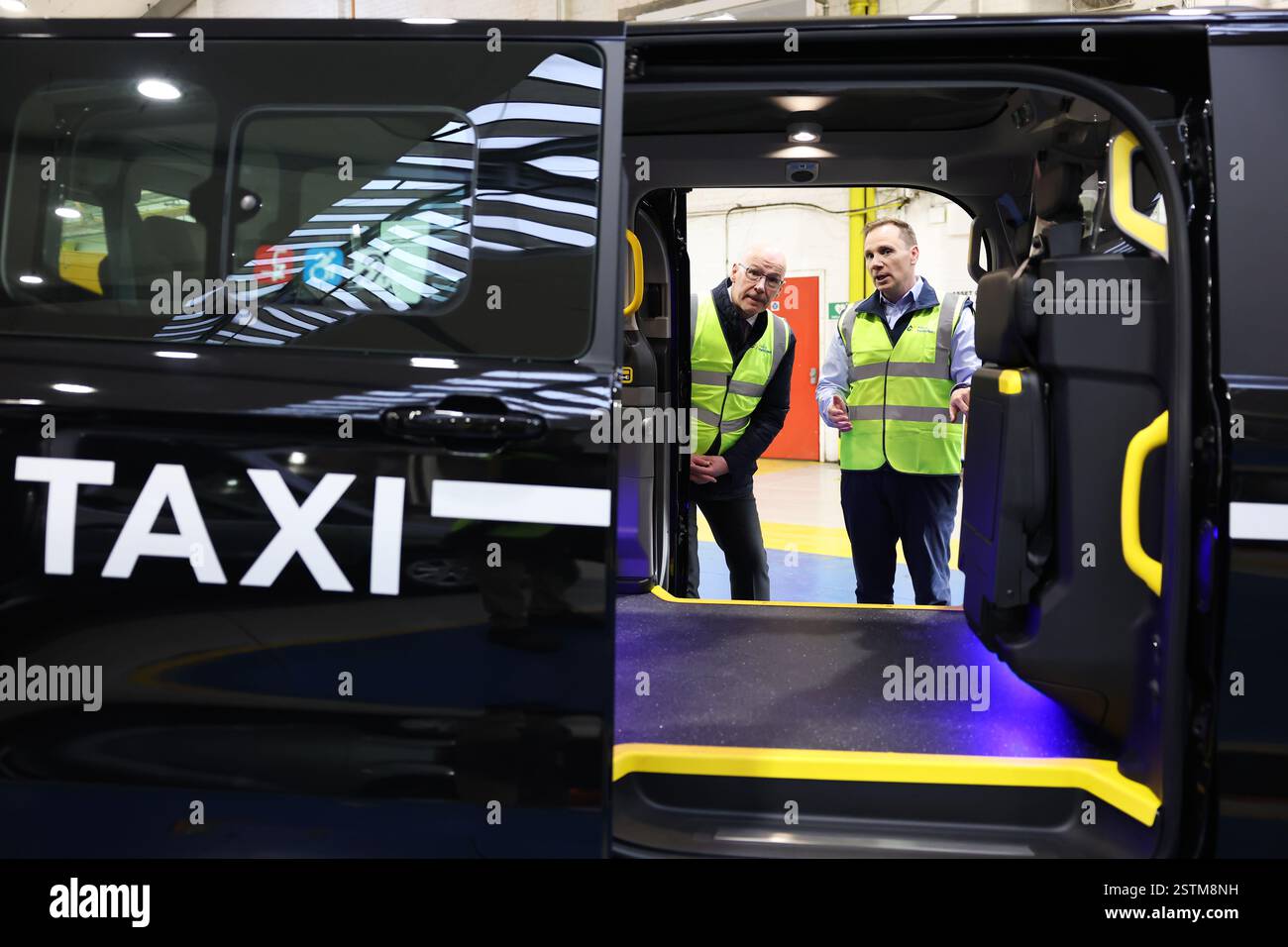 Scottish First Minister John Swinney (left) views a Ford MAXiCab during ...