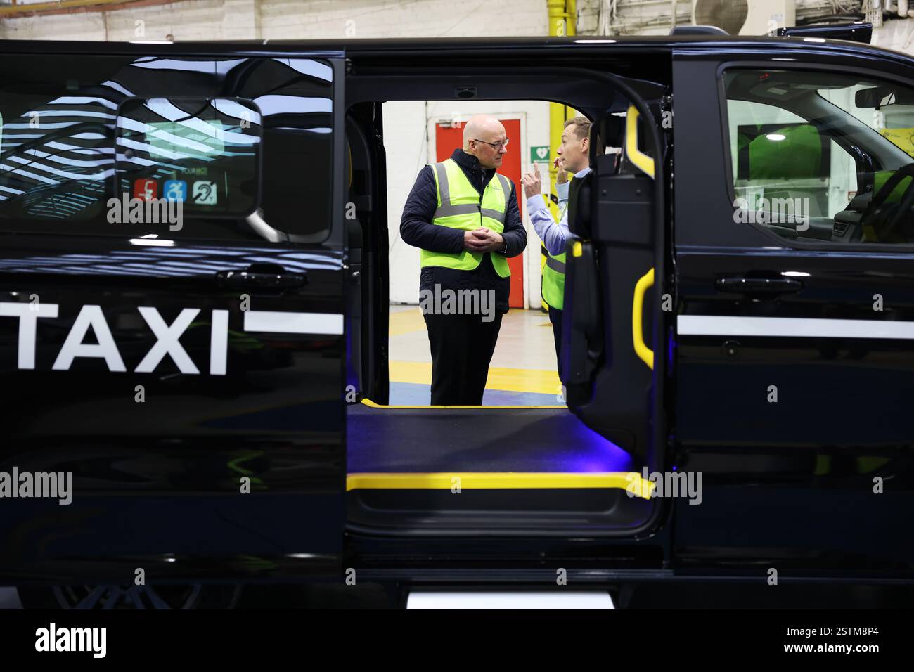 Scottish First Minister John Swinney (left) views a Ford MAXiCab during ...