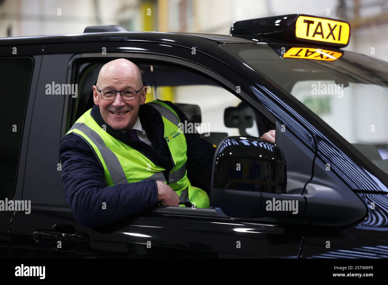Scottish First Minister John Swinney sits inside a Ford MAXiCab during ...