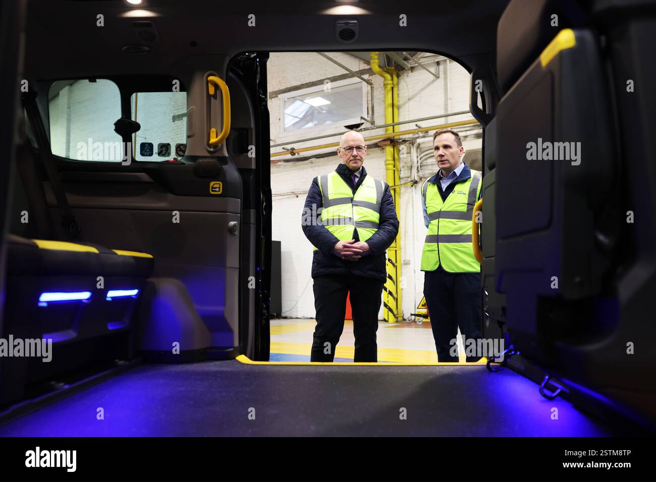 Scottish First Minister John Swinney (left) views a Ford MAXiCab during ...