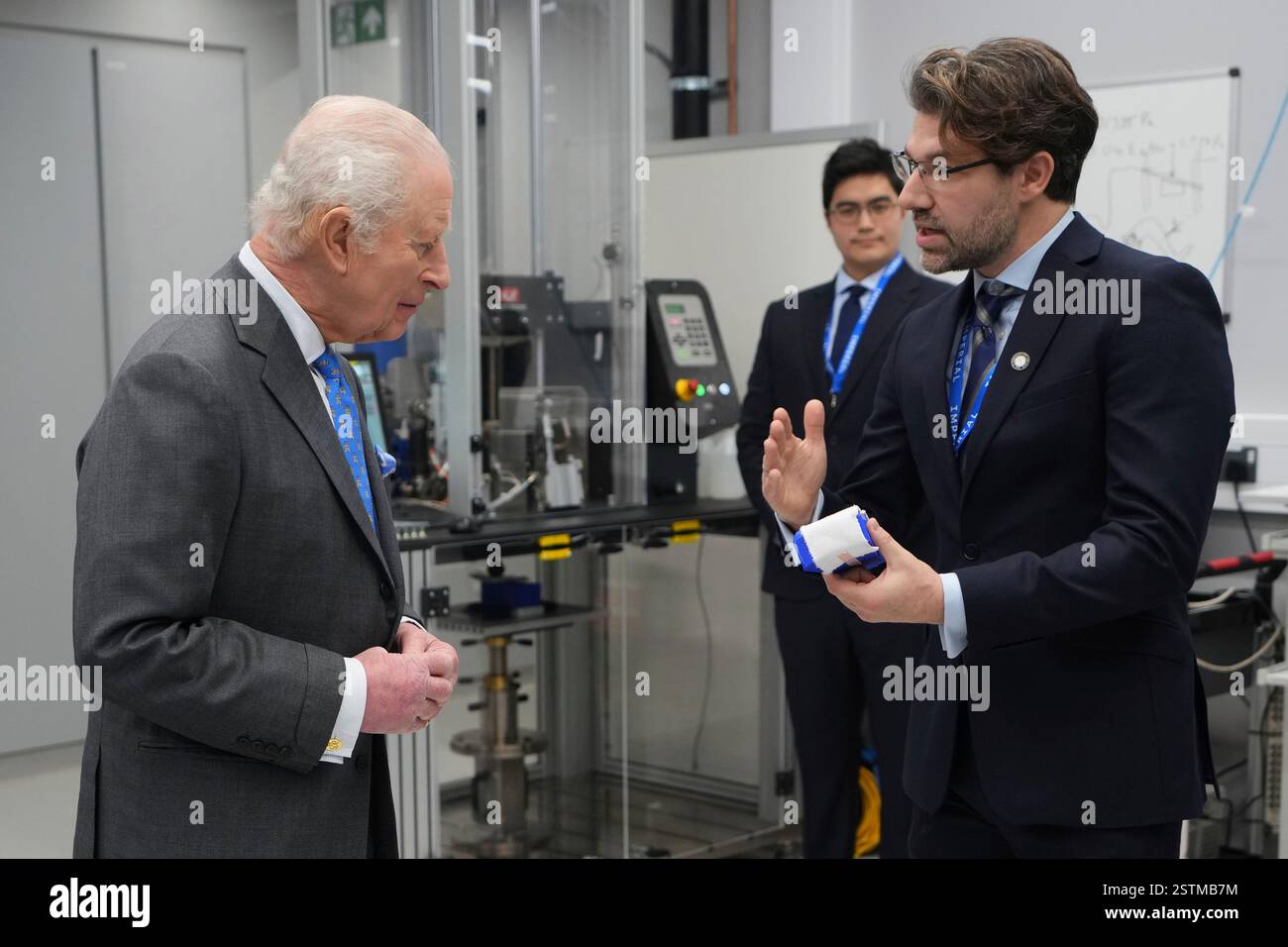 Britain's King Charles III is shown around a laboratory by researcher ...