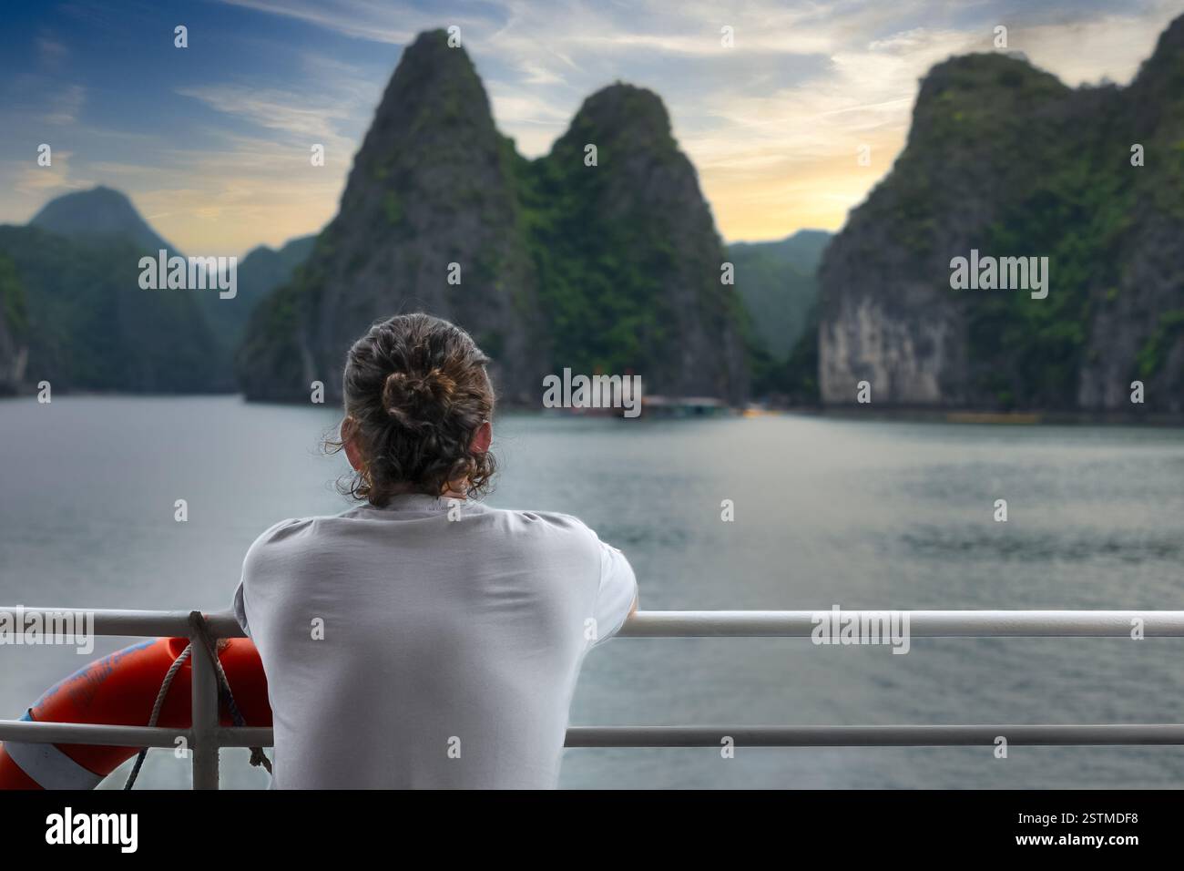 Man watching Beautiful landscape of Cat Ba Island from the tour boat ...