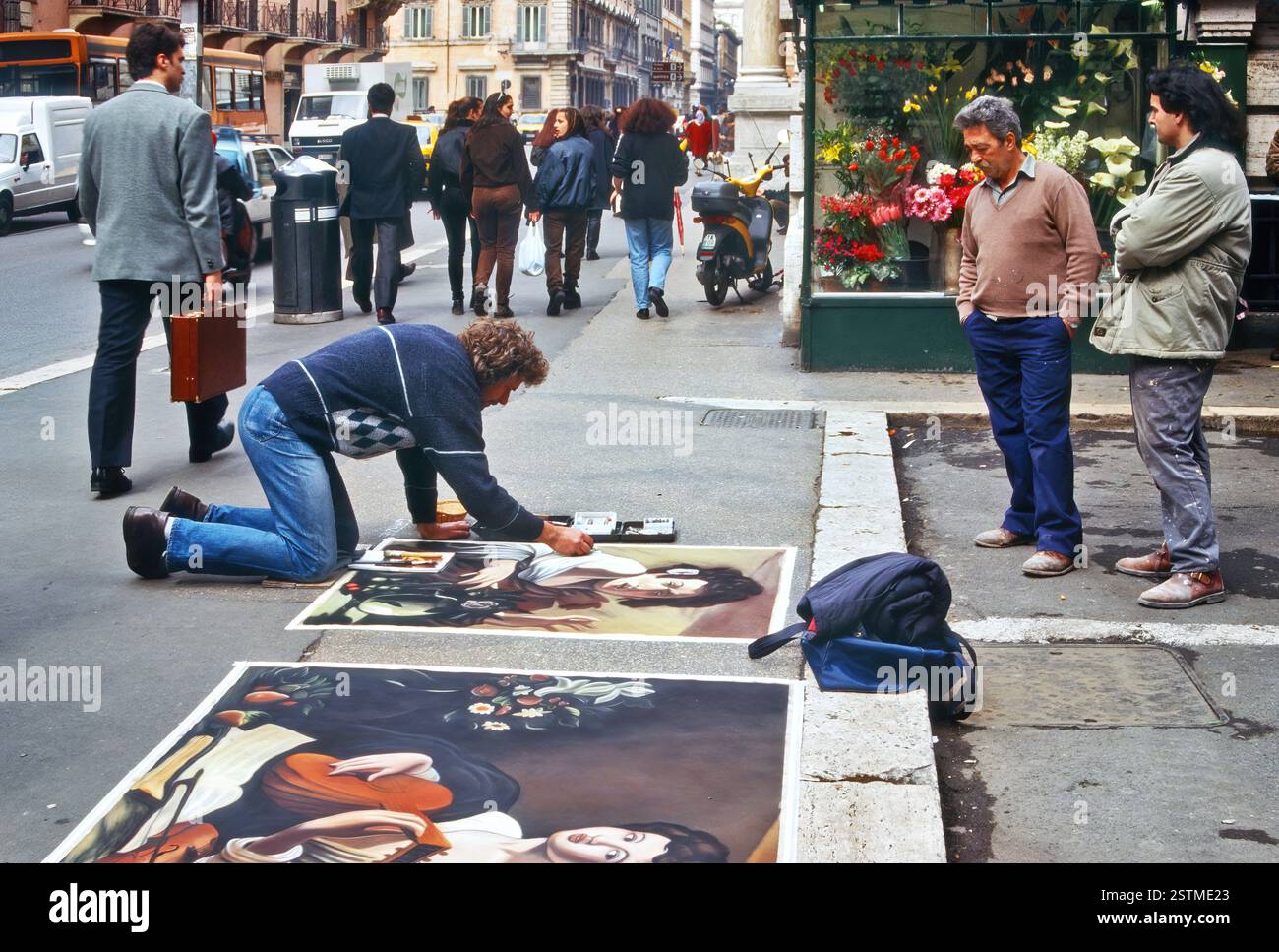 Artist working on his drawings at Via del Corso, busy street in Rome ...