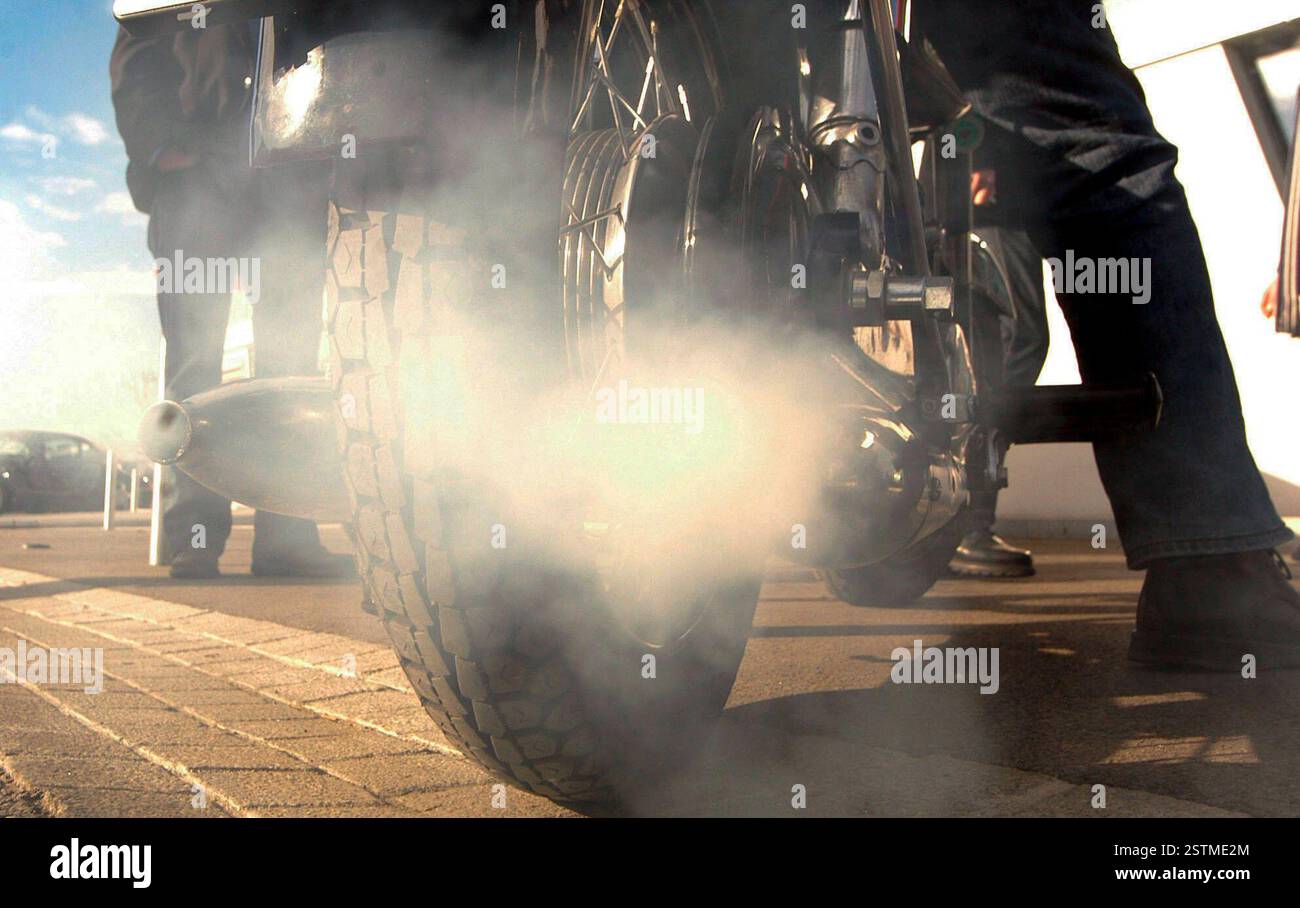 air pollution caused by motorcycle exhaust gas, cloud of smoke air ...