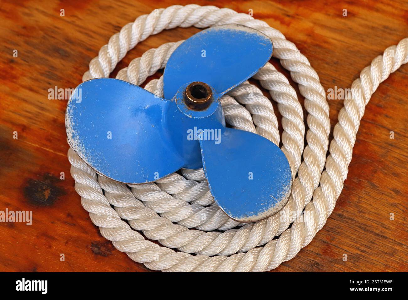 Blue Propeller at Pile of Rope Boat Stock Photo - Alamy