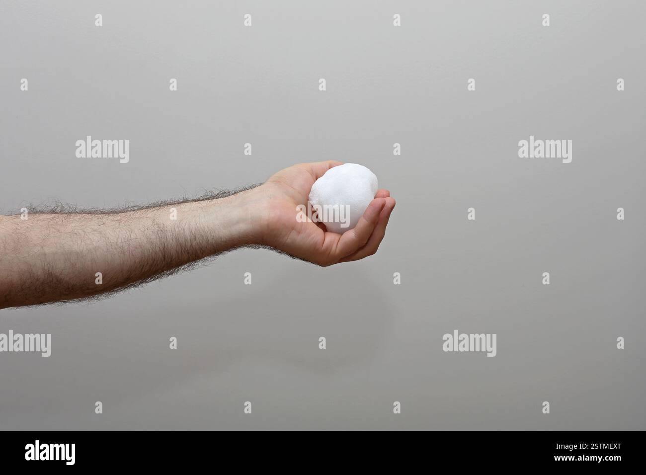Man holding ball in hand hi-res stock photography and images - Alamy