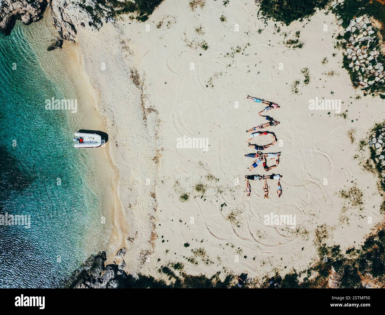 People write their words on the sand with their bodies Stock Photo - Alamy