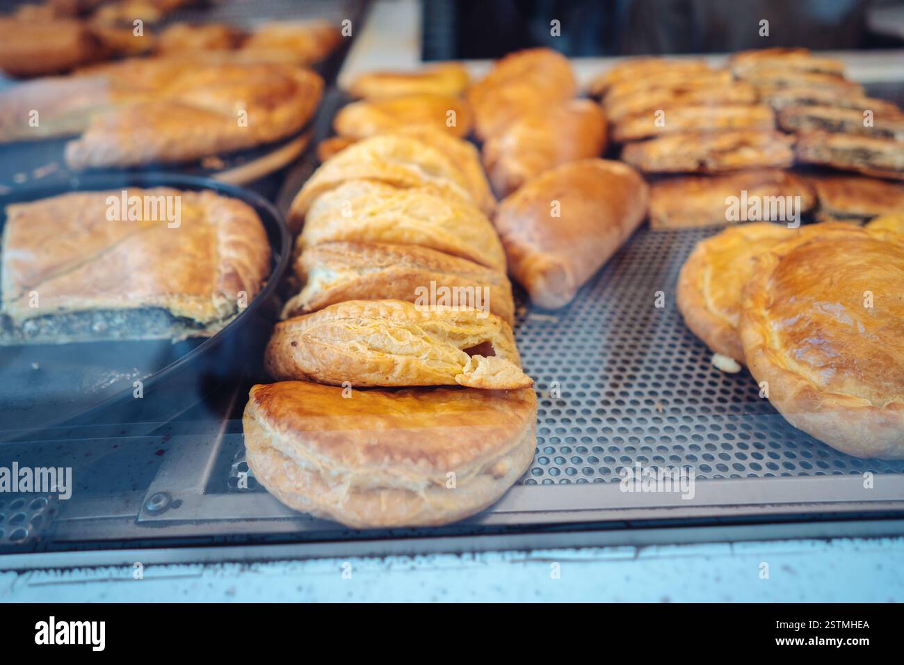 Fresh bakery in showcase of a street shop bakery food Stock Photo - Alamy