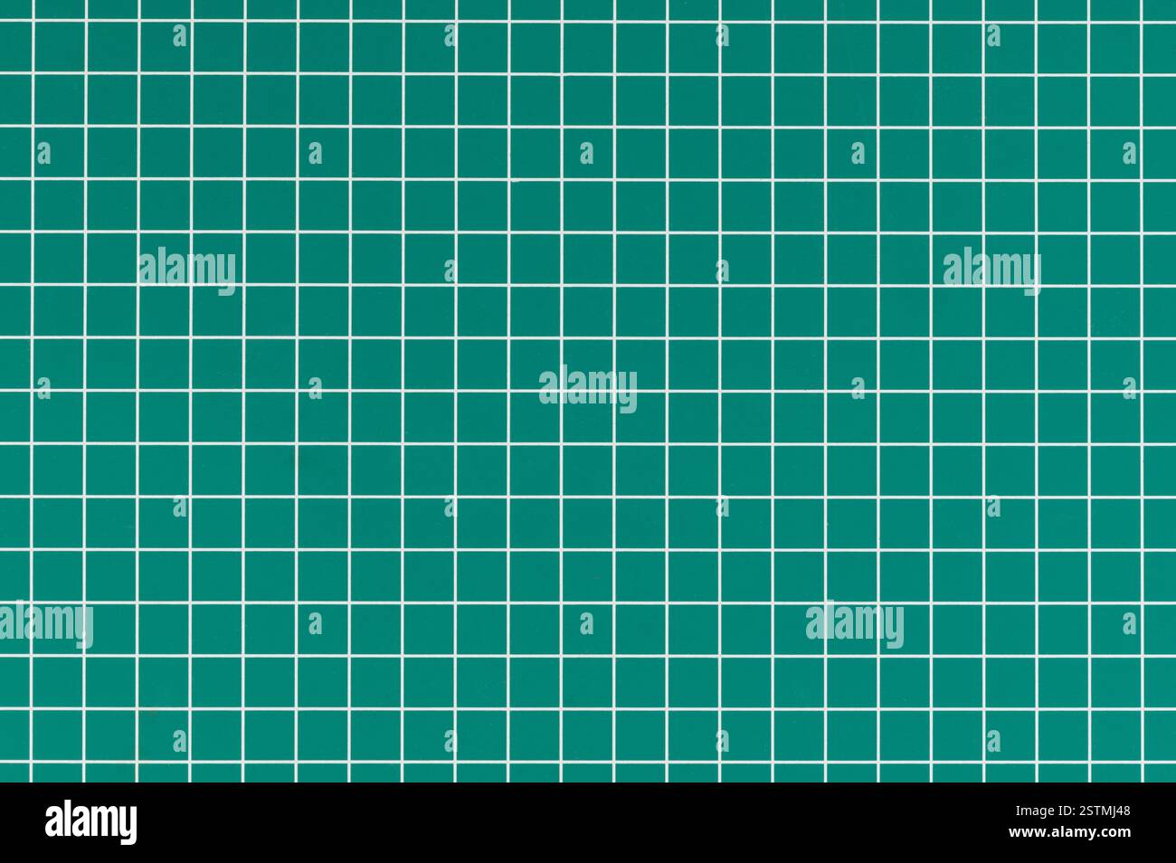 Vibrant green crafting surface featuring grid pattern, ideal for ...