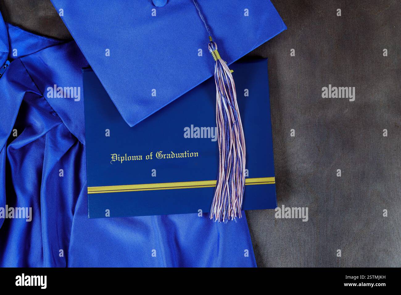 Graduation cap, diploma symbolize milestone in academic achievement ...