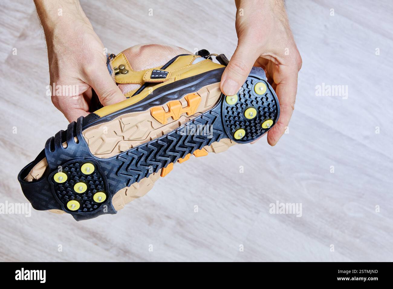 Traction cleats attached to boot sole provide enhanced grip and safety ...