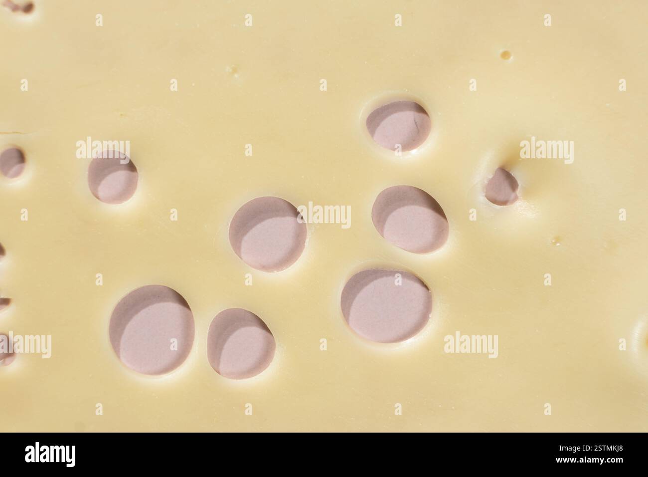 Smooth Yellow Cheese with Characteristic Holes Stock Photo - Alamy