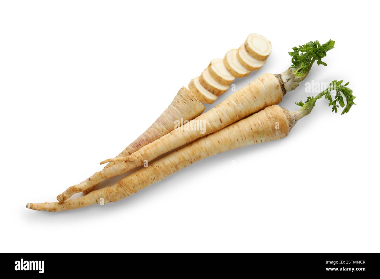 Whole and cut fresh parsley roots isolated on white, top view Stock ...