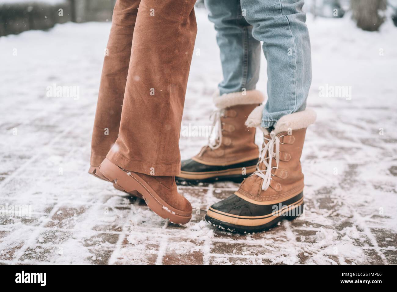 Boyfriend and girlfriend posing for the camera, legs only Stock Photo ...