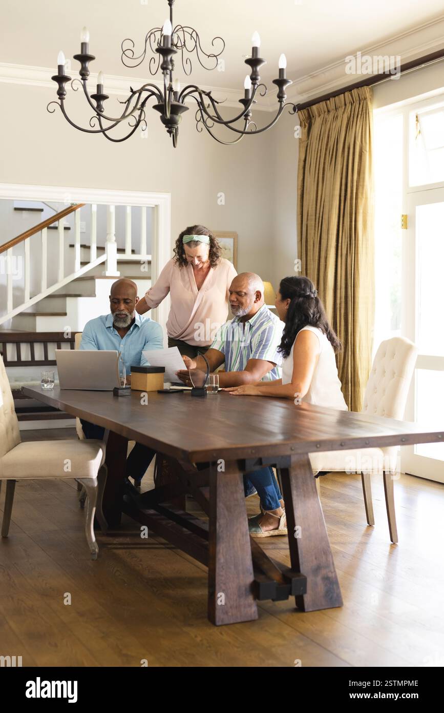 Seniors having conversation dining table hi-res stock photography and ...