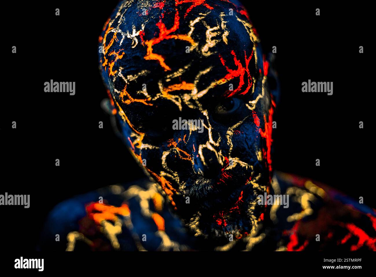 Man's Face Painted in Neon UV Lava Stock Photo - Alamy