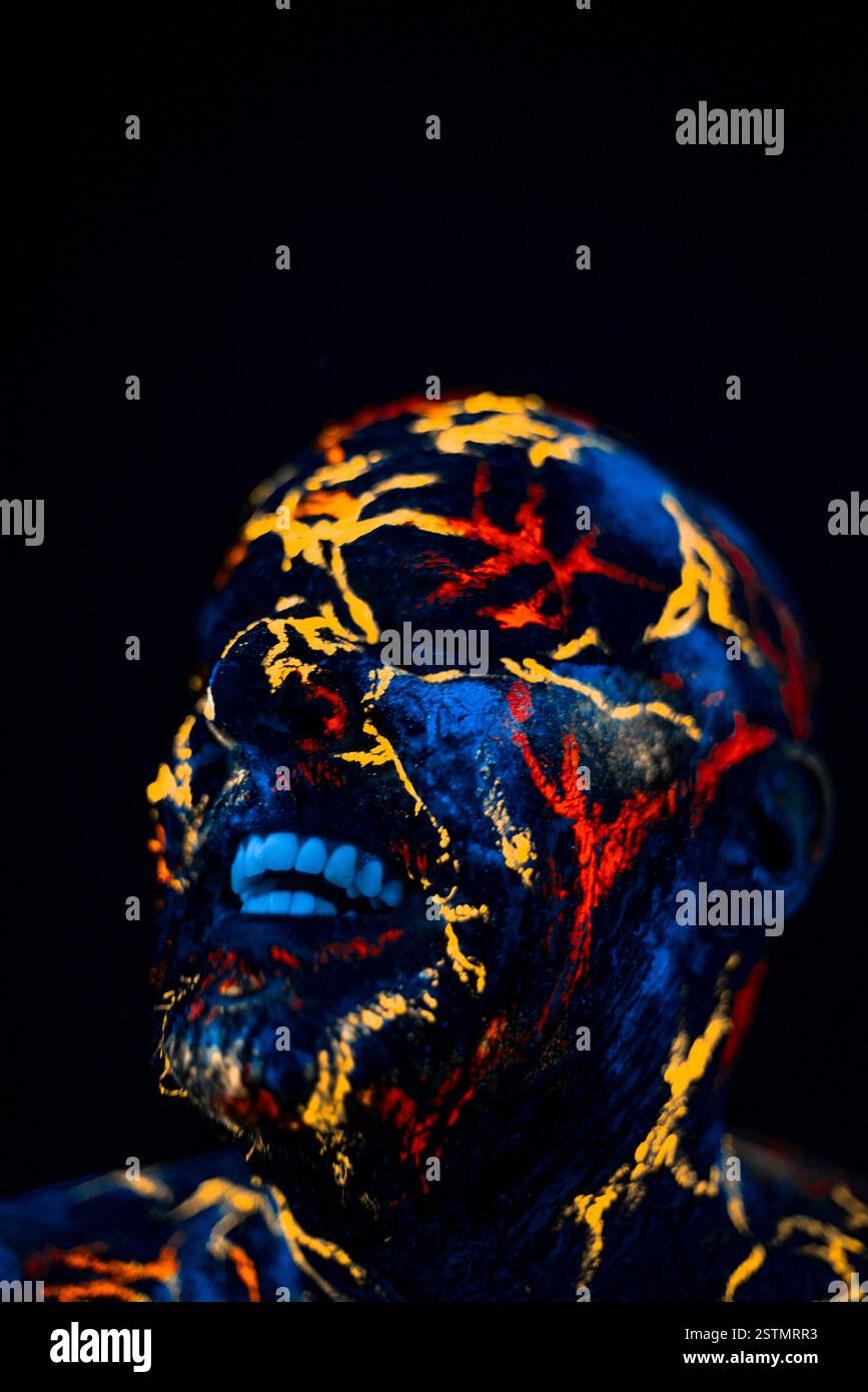 Man's Face Painted in Neon UV Lava Stock Photo - Alamy