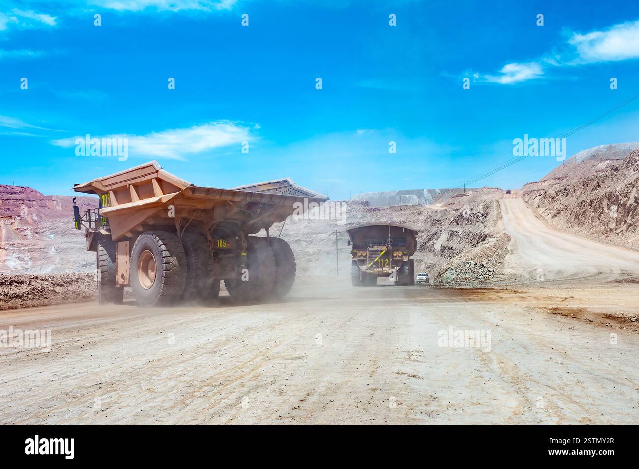 Dump trucks at an open-pit copper mine Stock Photo - Alamy