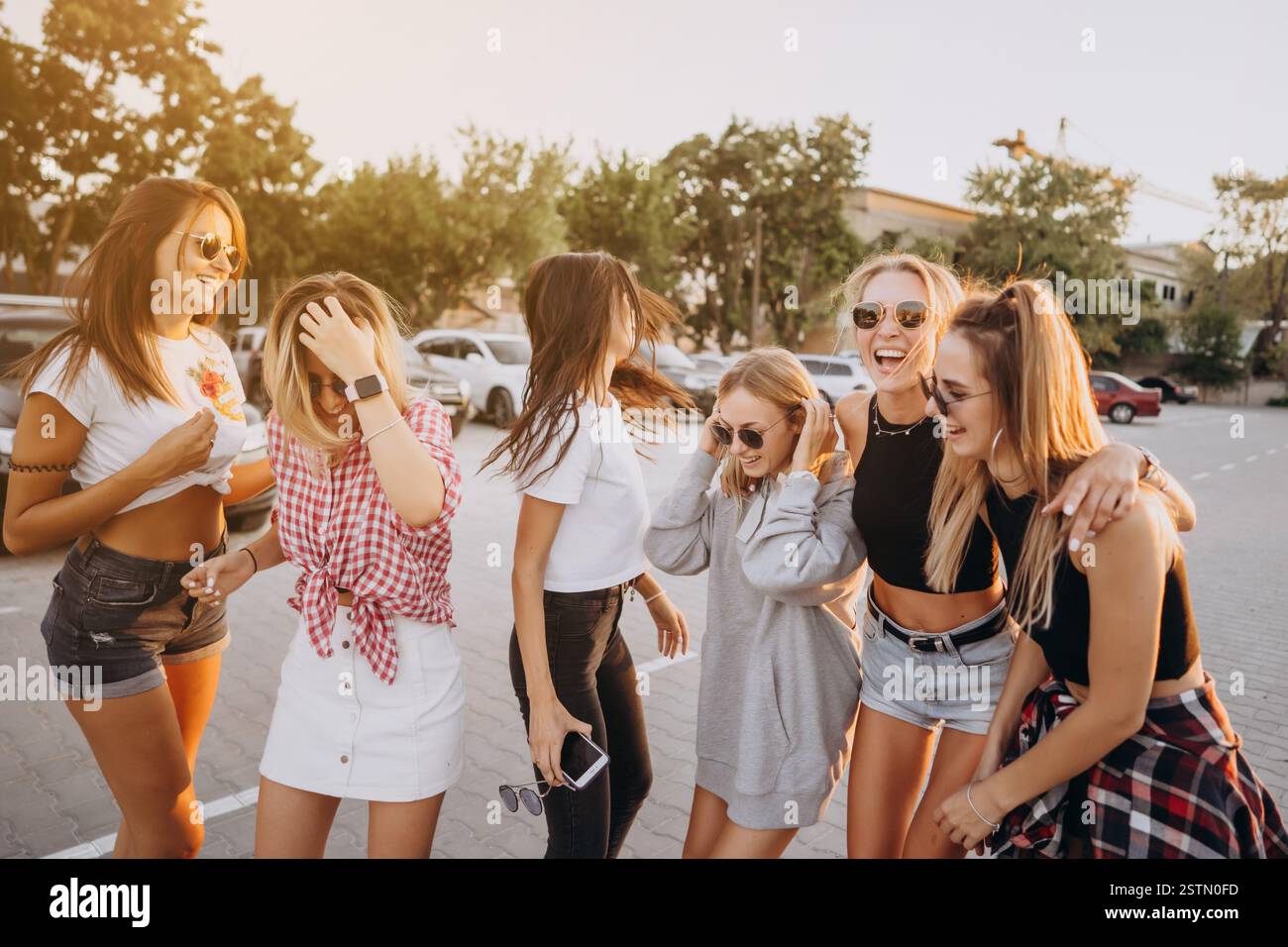 Six young women dance in a car park Stock Photo - Alamy