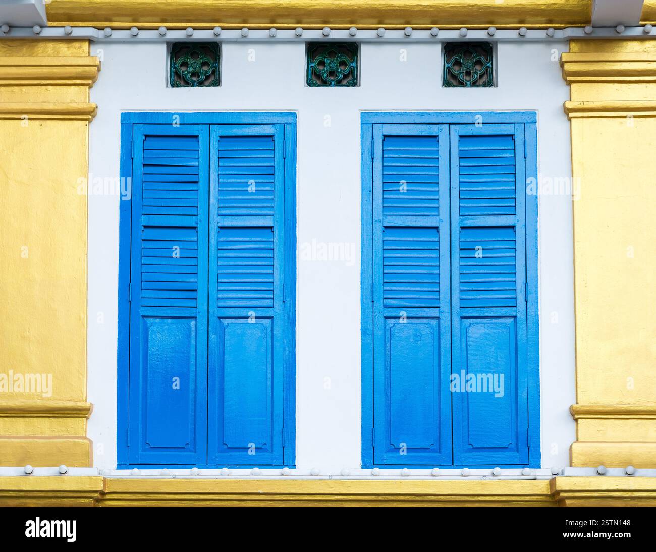 Bright blue shutters in Singapore Stock Photo - Alamy