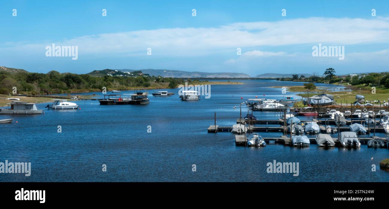 Knysna lagoon marina South Africa. Boats anchored on calm water, blue ...