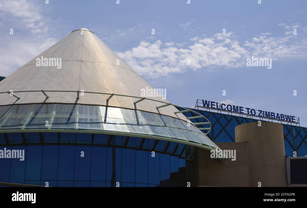 Welcome sign at Victoria Falls airport terminal building facade ...