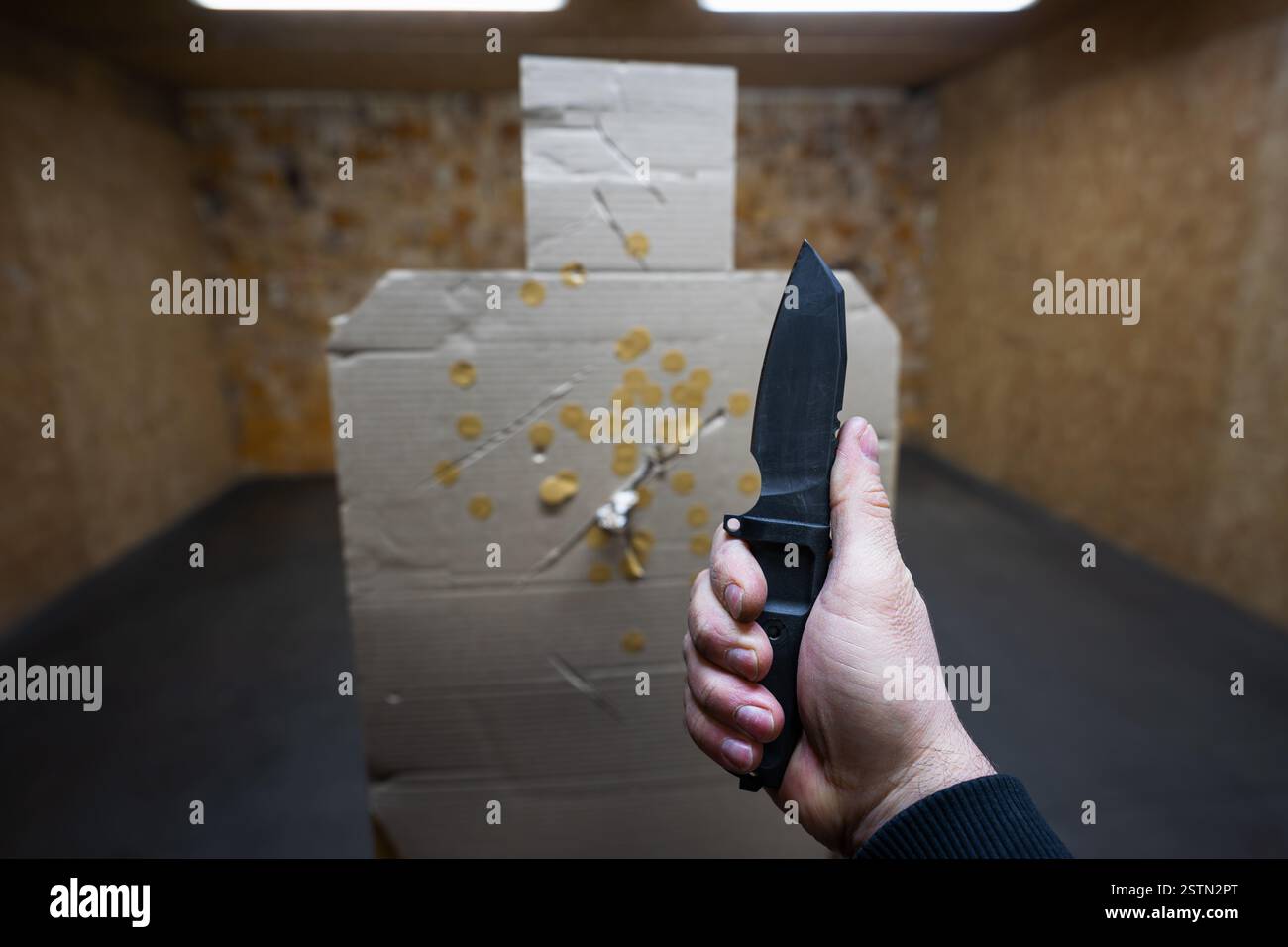 Knife fighting training, first-person view. Sharp knife in a man's hand ...