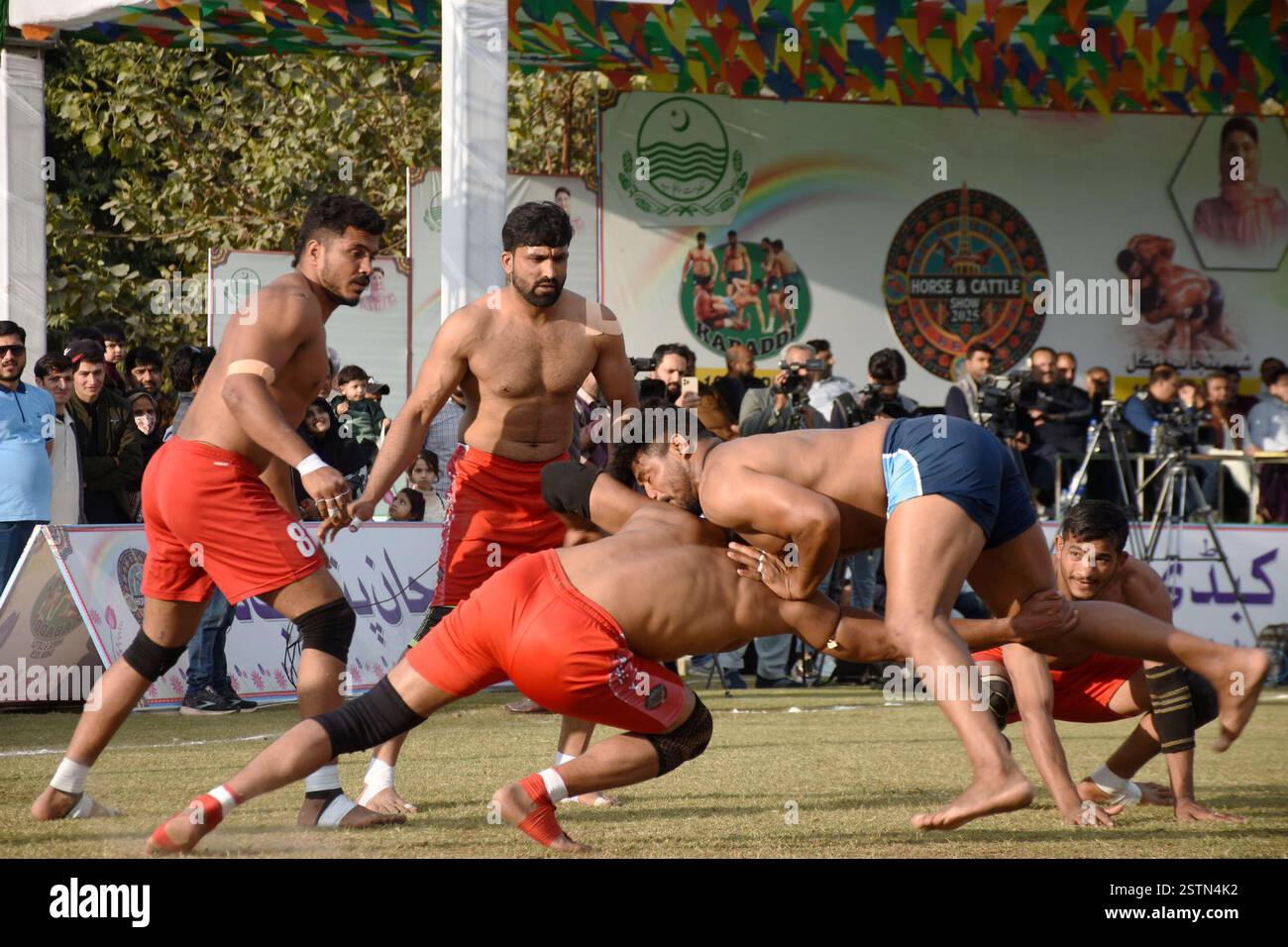 Lahore, Pakistan. 18th Feb, 2025. People compete in a Kushti match in ...