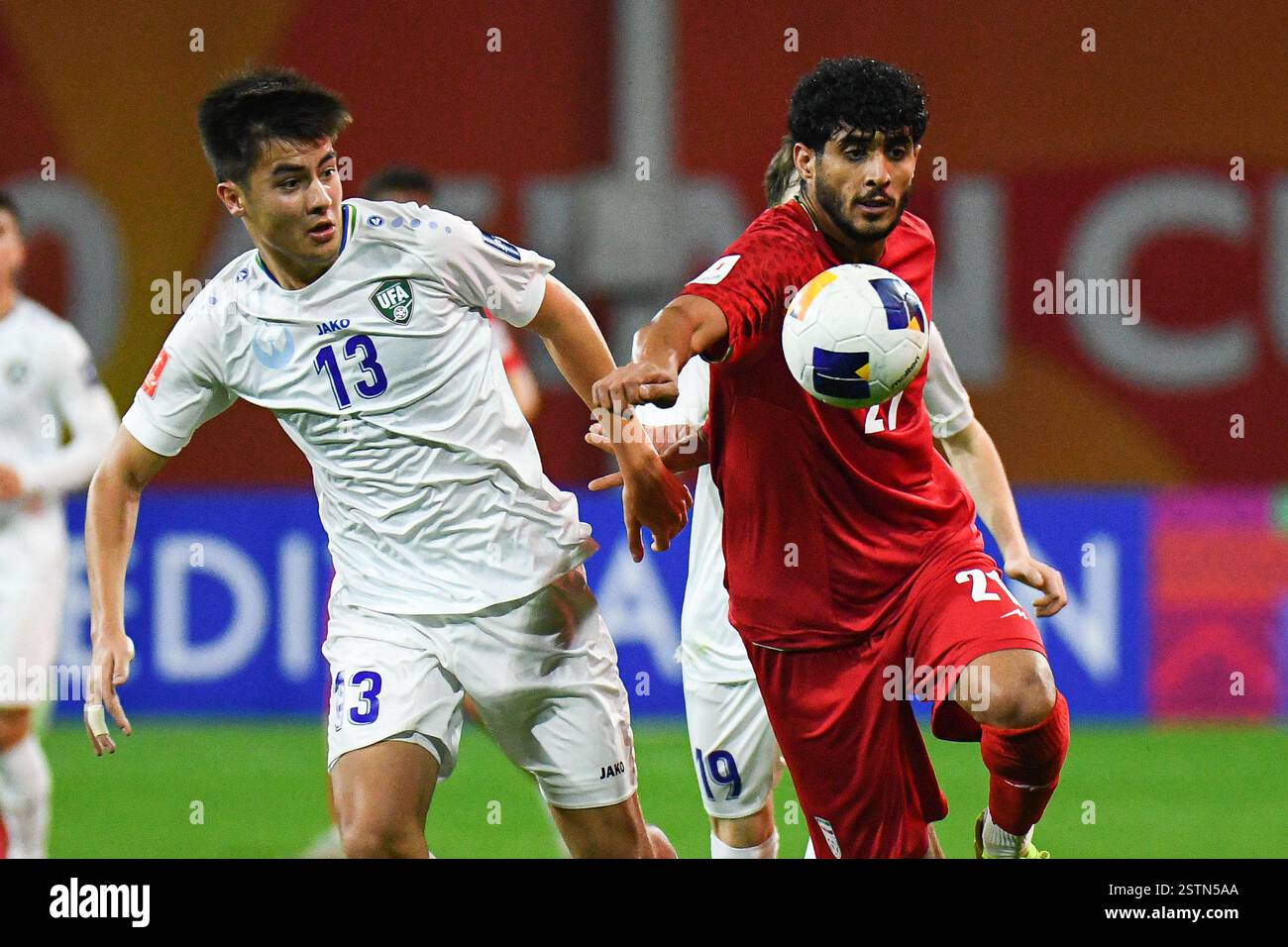 Shenzhen, China. 19 February, 2025. Bekhruz Dzhumatov #13 of Uzbekistan during the 2025 AFC U20 ...