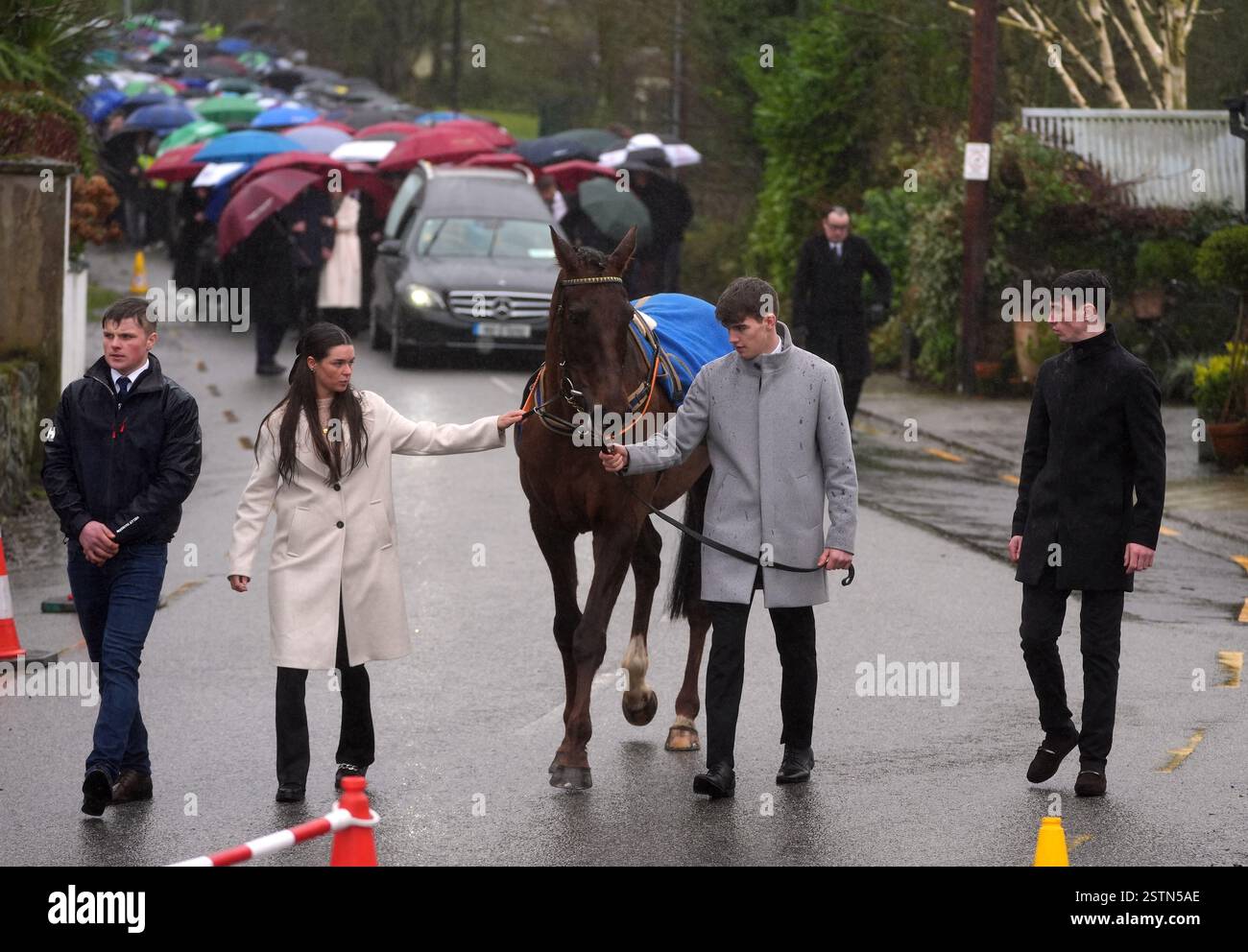 The hearse carrying the coffin of Michael O'Sullivan is lead by a horse ...
