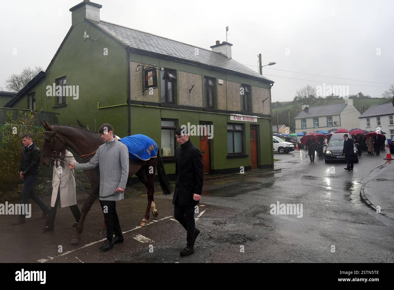 The hearse carrying the coffin of Michael O'Sullivan is lead by a horse ...