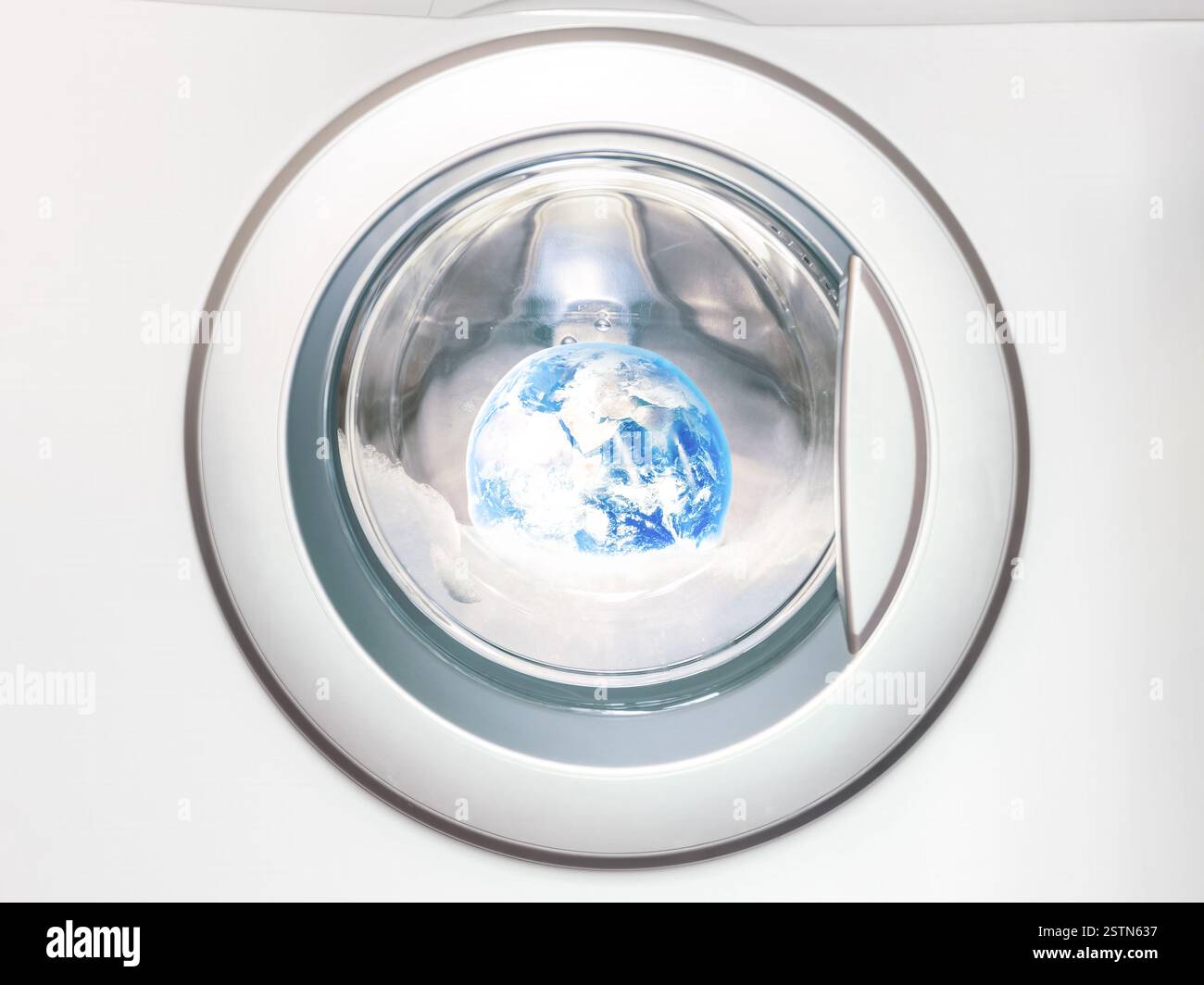 Striking photo collage featuring Earth emerging from a washing machine ...