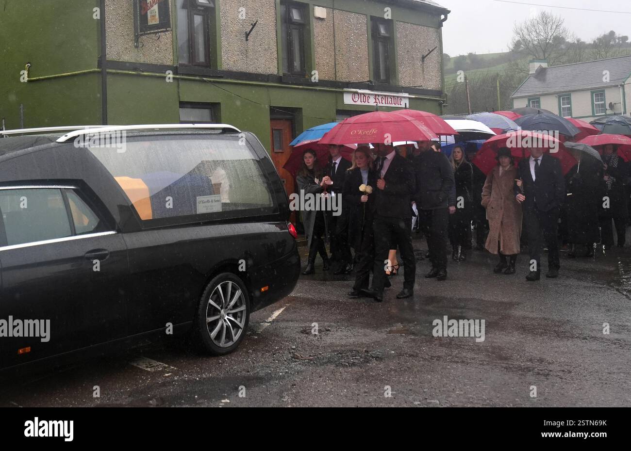 The hearse carrying the coffin of Michael O'Sullivan is lead by a horse ...