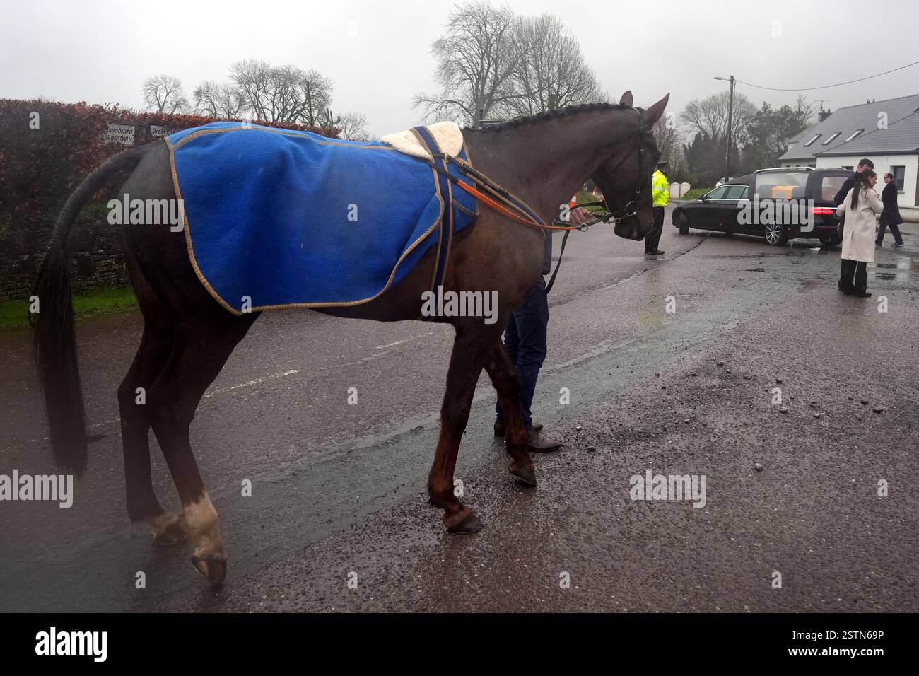 The hearse carrying the coffin of Michael O'Sullivan is lead by a horse ...