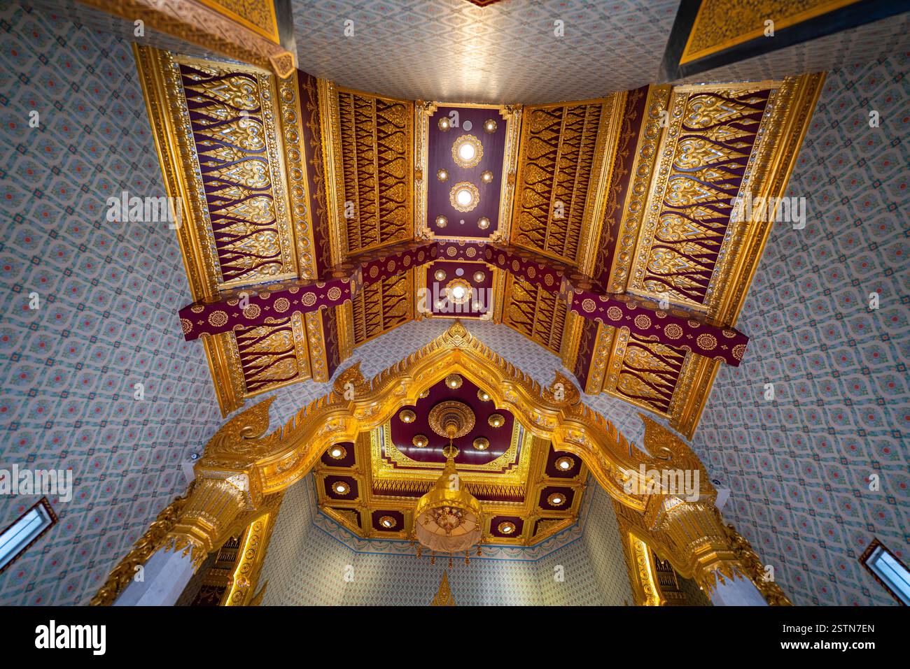 beautiful ceiling decorate in Thai style at Wat Traimit Bangkok Thailand. The world's largest ...