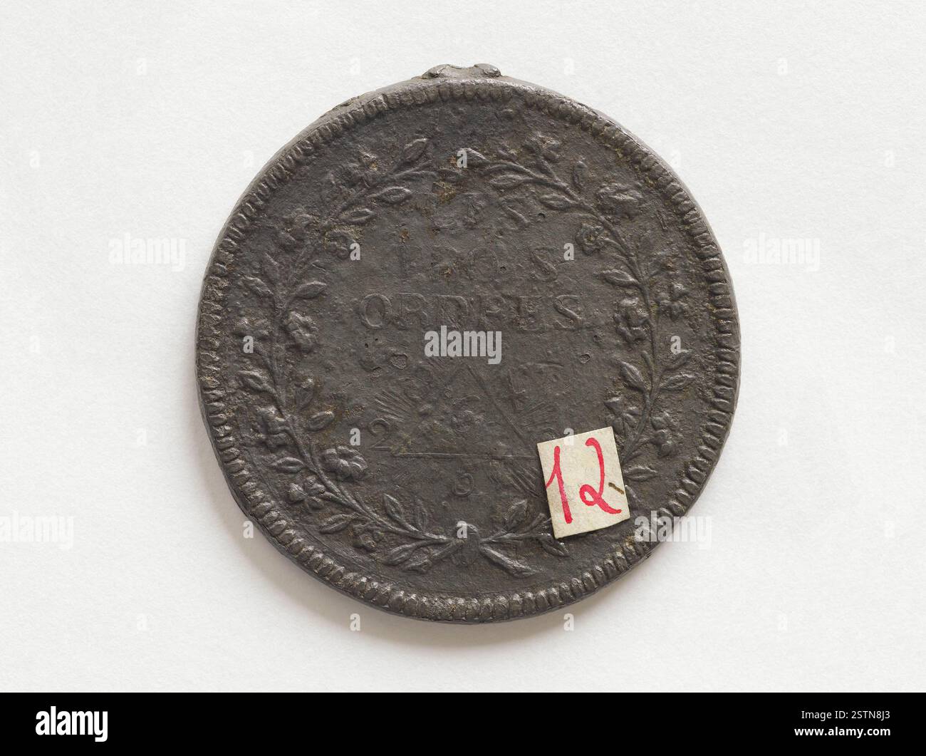 This 1789 medal shows a peasant from the Third Estate carrying the ...