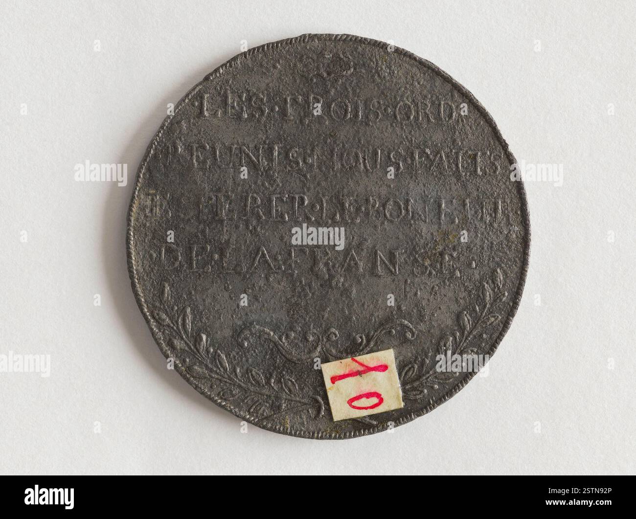 A 1789 numismatic medal depicting the crown of France on an altar ...