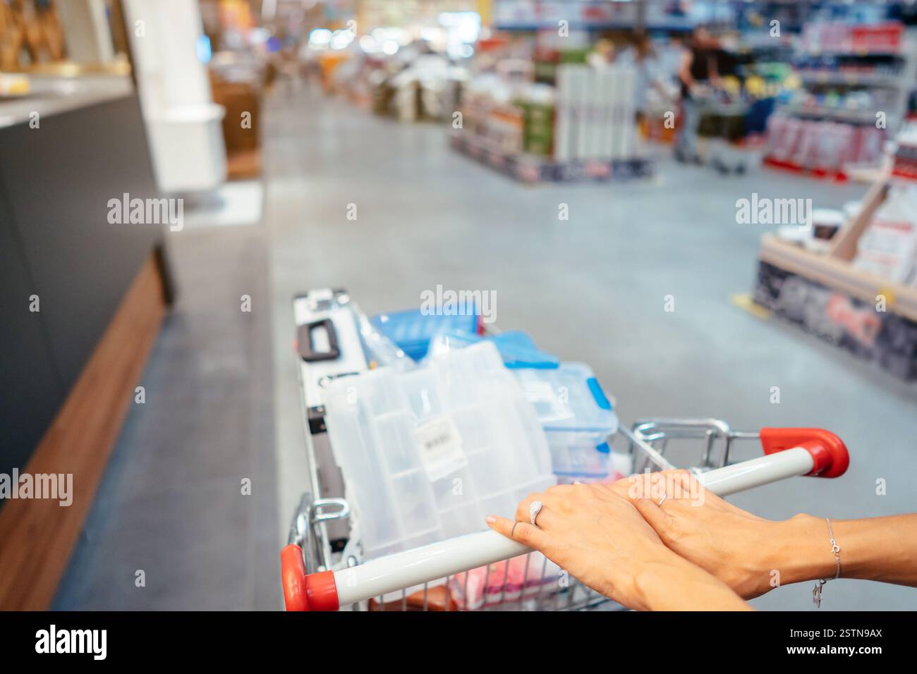 Human Hand Close Up With Shopping Cart in a Supermarket Walking Through ...